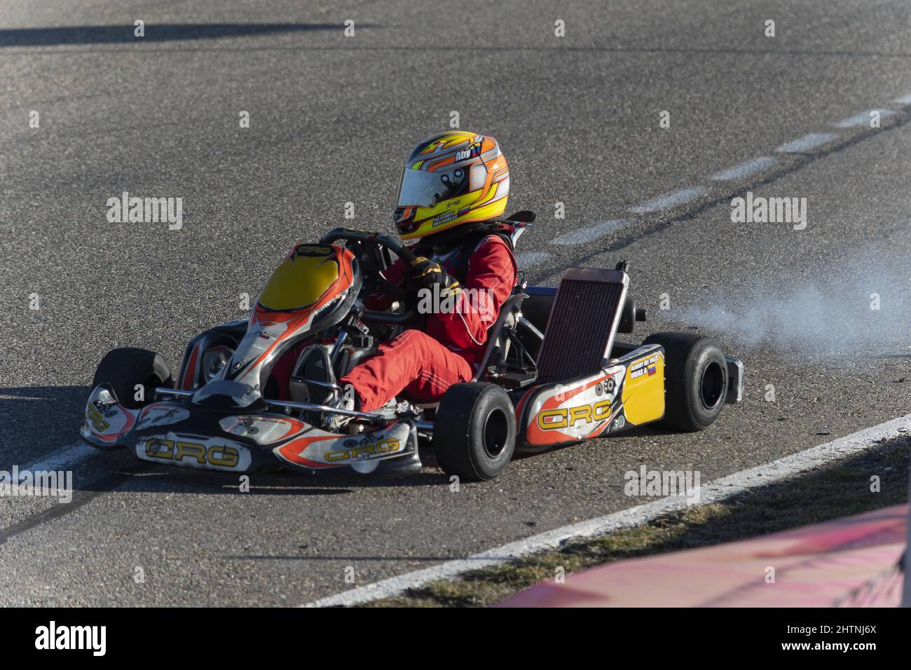 Closeup of a Man racing Go-cart on karting circuit in Toledo, Spain ...