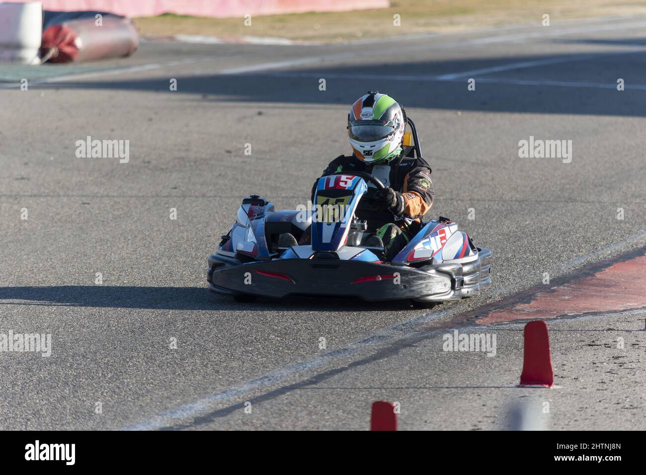 Closeup of a Man racing Go-cart on karting circuit in Toledo, Spain ...