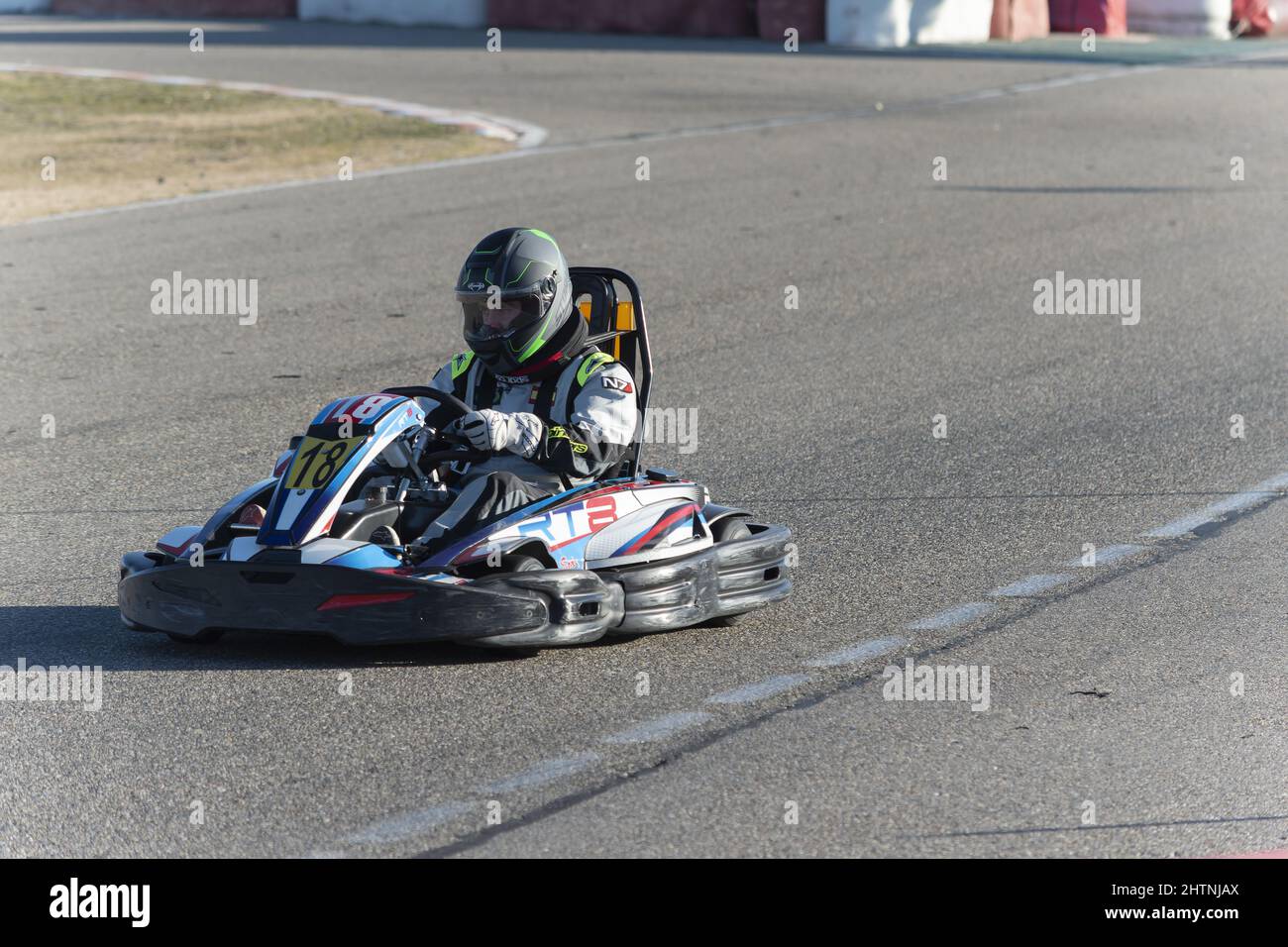 Closeup of a Man racing Go-cart on karting circuit in Toledo, Spain ...