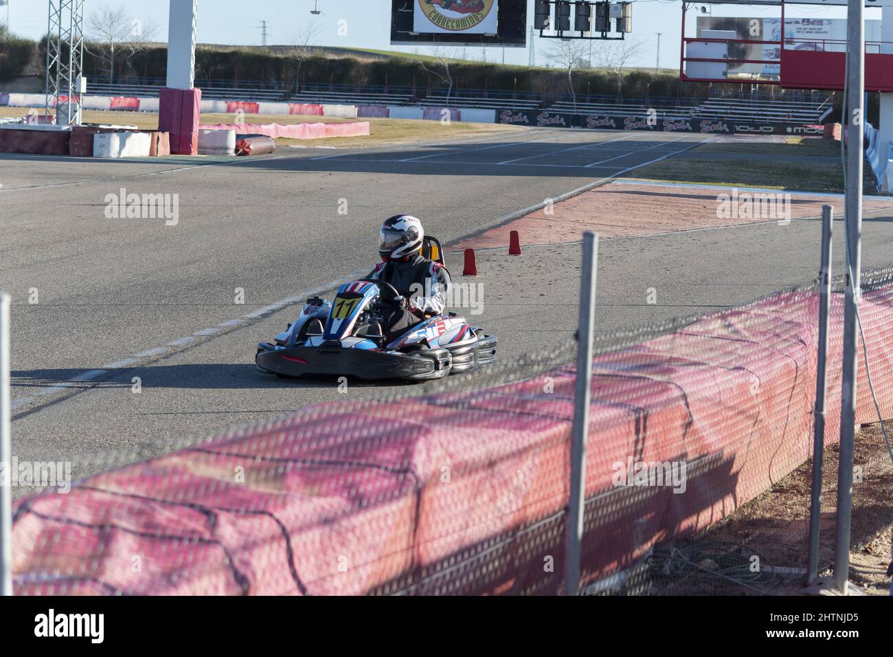 A closeup of a Man racing Go-cart on karting circuit in Toledo, Spain ...