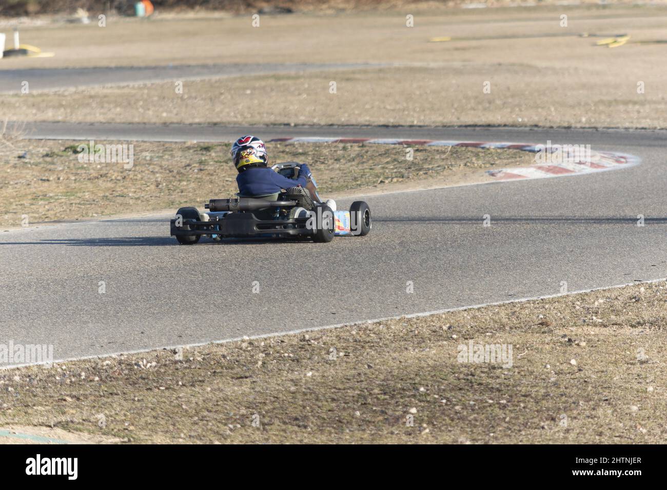 Closeup of a Man racing Go-cart on karting circuit in Toledo, Spain ...