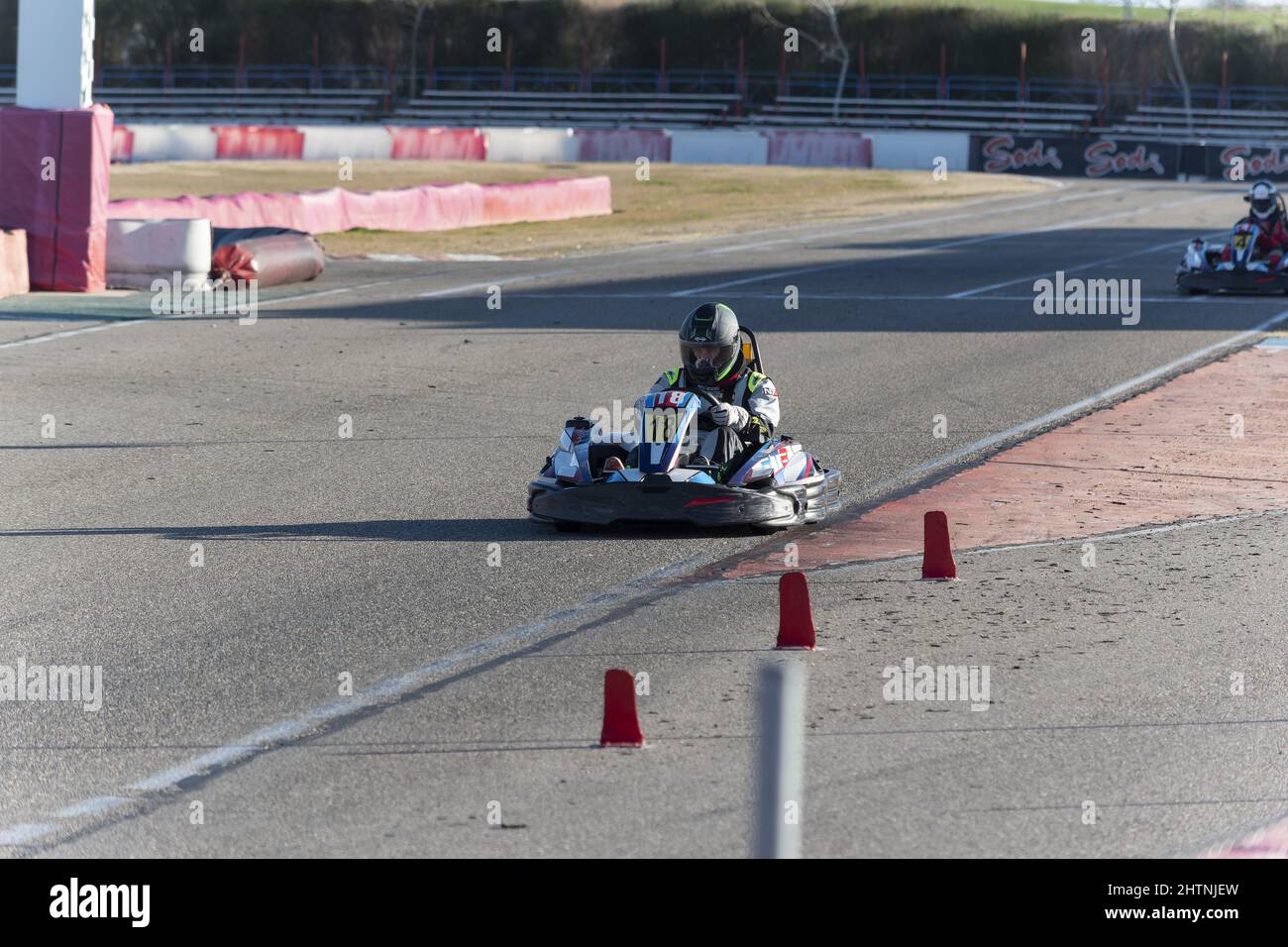Closeup of a Man racing Go-cart on karting circuit in Toledo, Spain ...