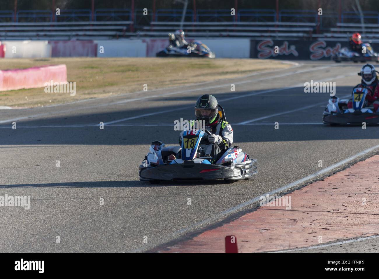 Closeup of a Man racing Go-cart on karting circuit in Toledo, Spain ...