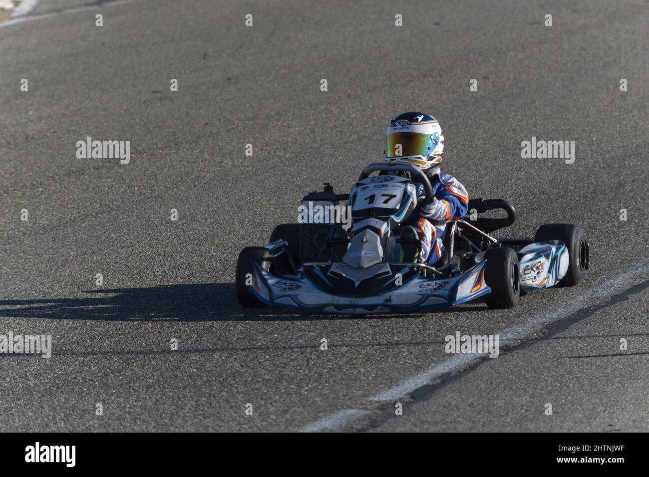 Man racing go-kart on a karting track Stock Photo - Alamy