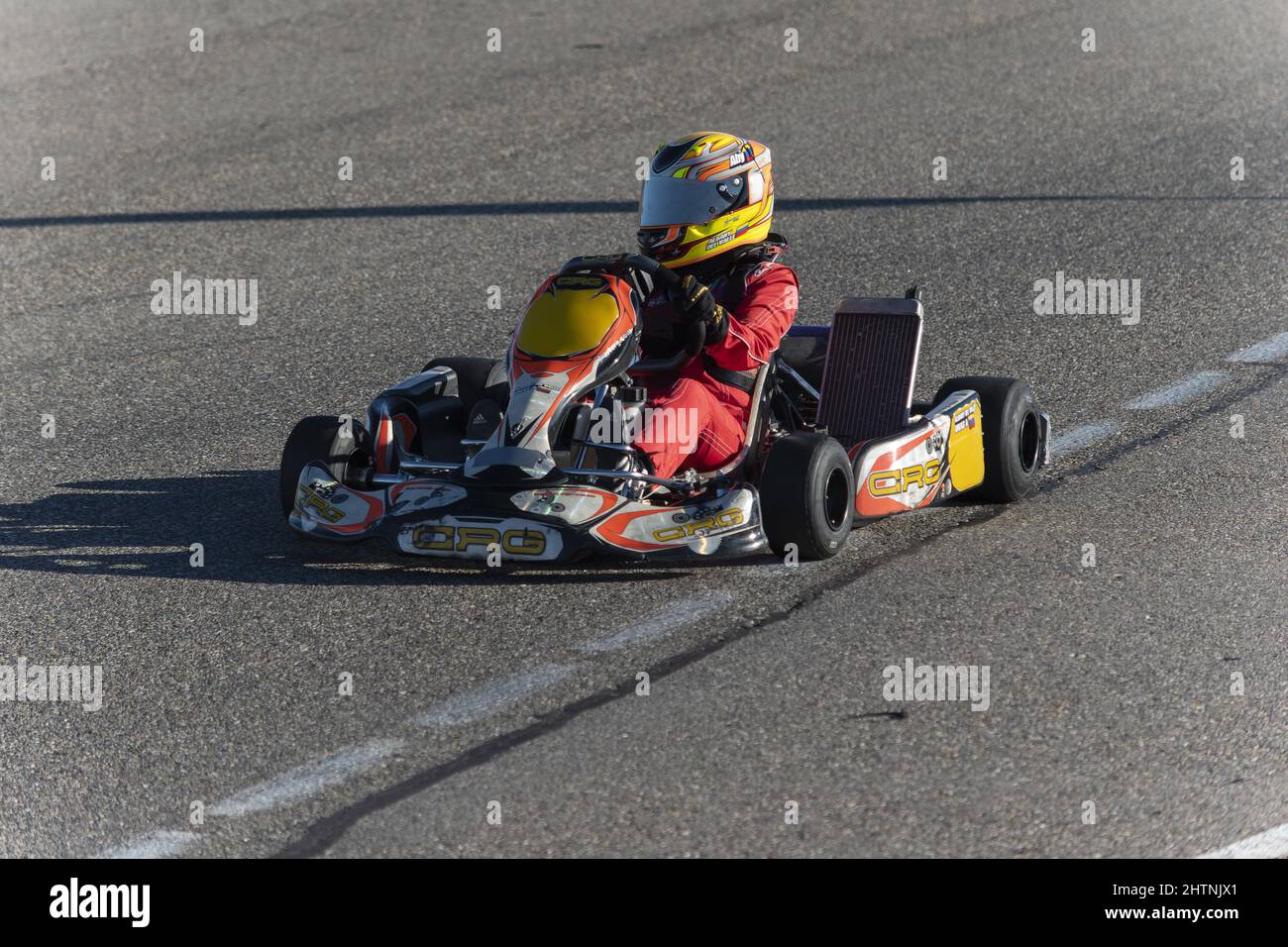 Man racing go-kart on a karting track Stock Photo - Alamy