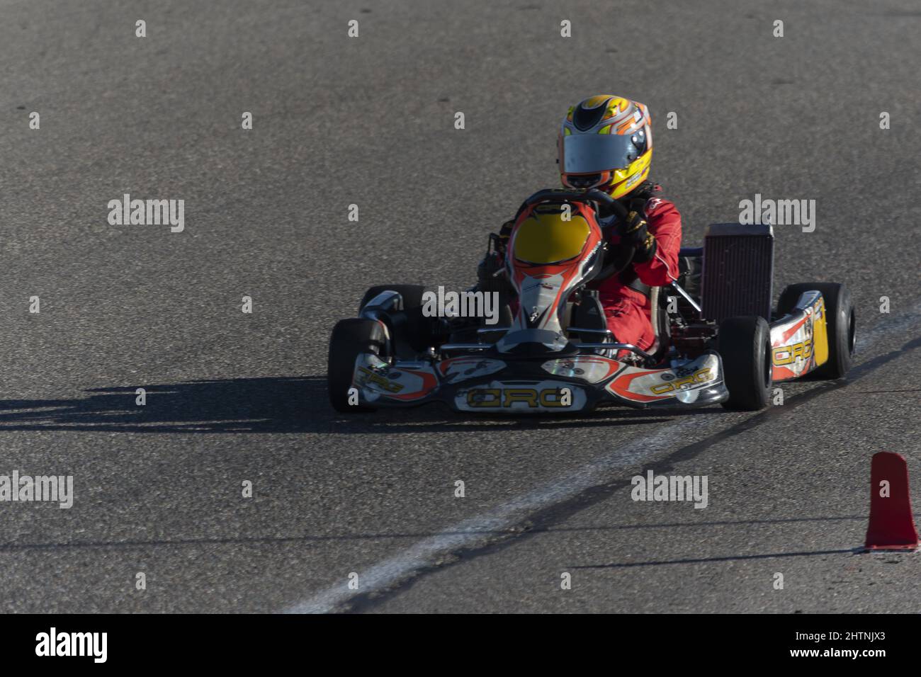 Man racing go-kart on a karting track Stock Photo - Alamy