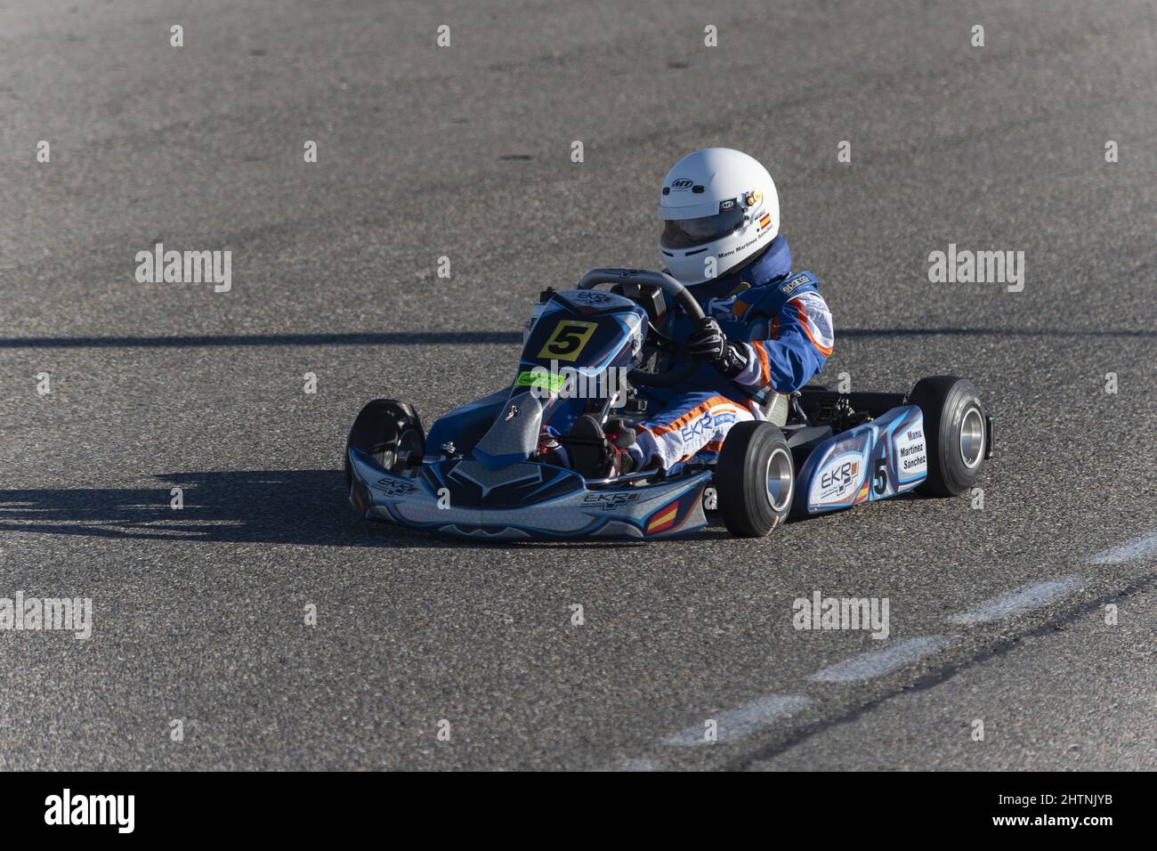 Man racing go-kart on a karting track Stock Photo - Alamy