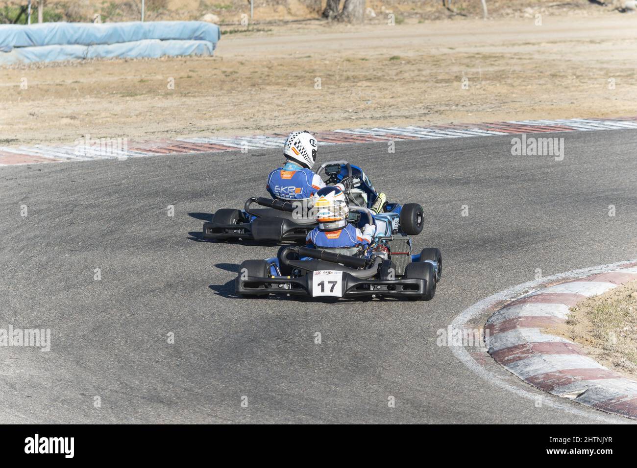 Men racing go-kart on a karting track Stock Photo - Alamy