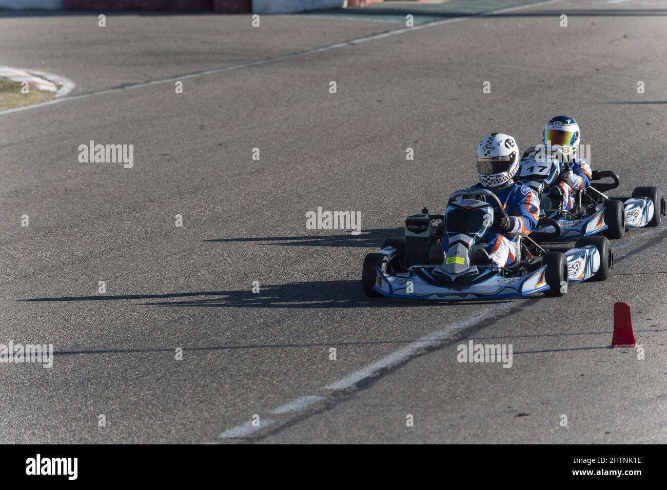 Men racing go-kart on a karting track Stock Photo - Alamy