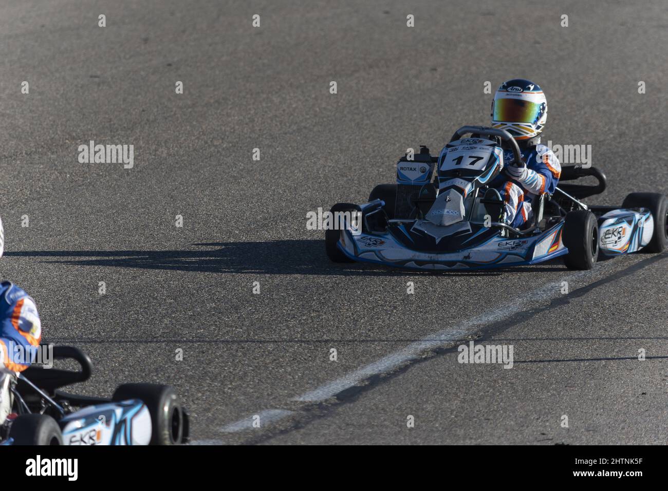 Man racing go-kart on a karting track Stock Photo - Alamy