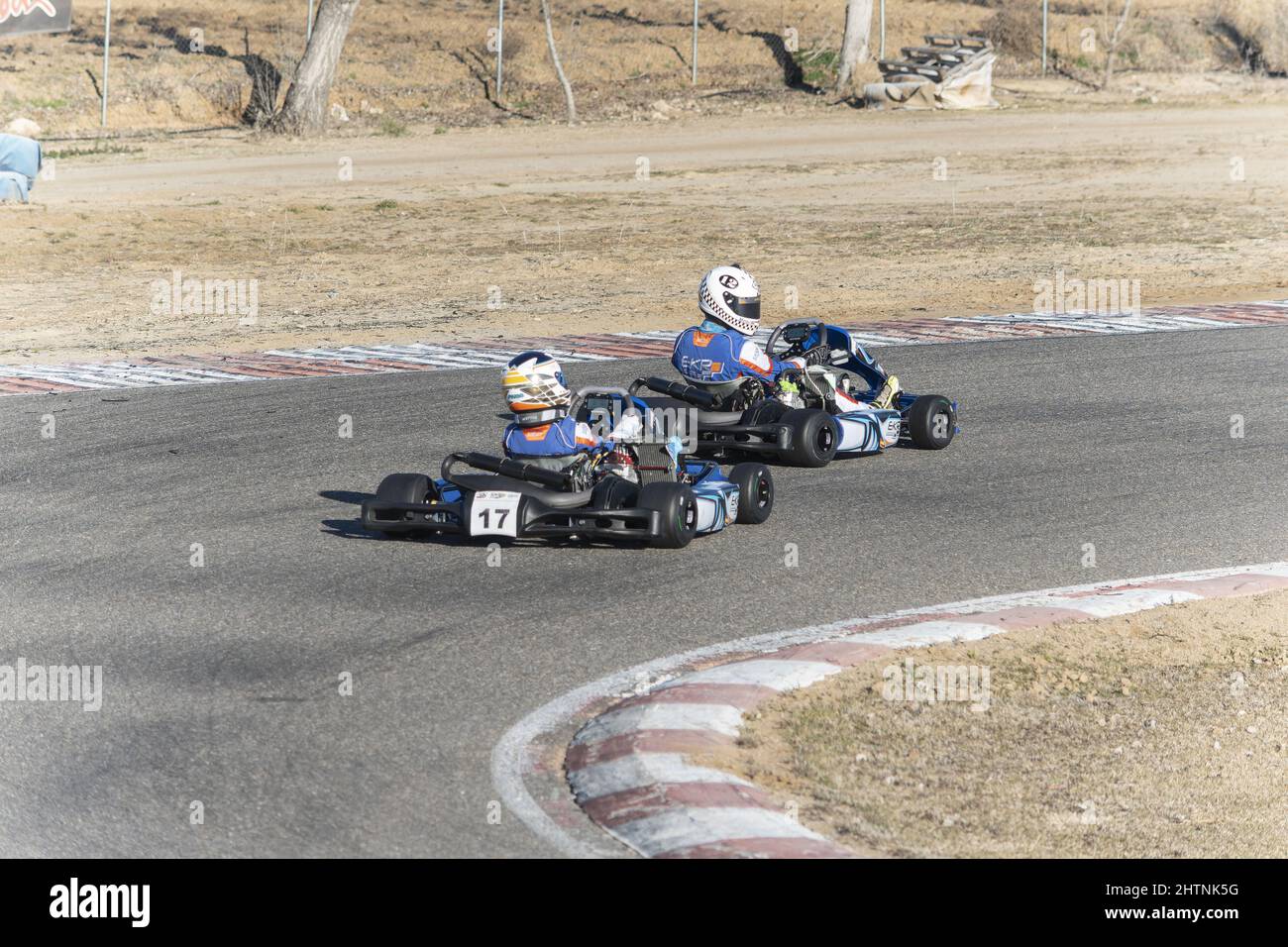 Men racing go-kart on a karting track Stock Photo - Alamy