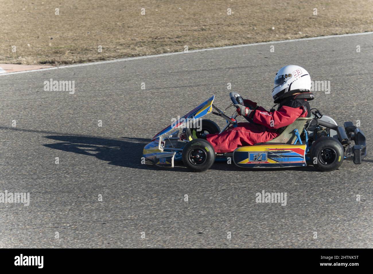 Man racing go-kart on a karting track Stock Photo - Alamy