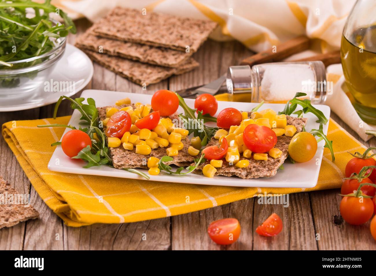Crispy rye bread with sesame seeds, arugula and sweet corn Stock Photo ...
