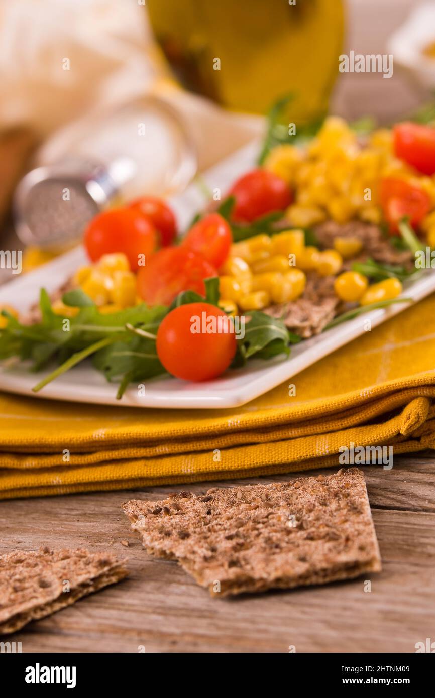 Crispy rye bread with sesame seeds, arugula and sweet corn Stock Photo ...