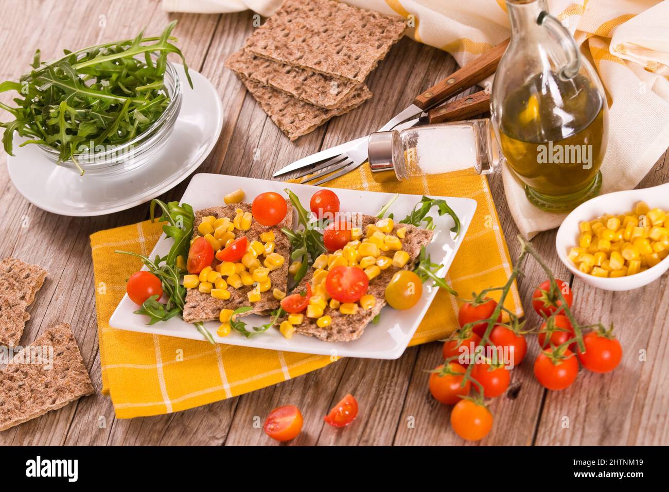Crispy rye bread with sesame seeds, arugula and sweet corn Stock Photo ...