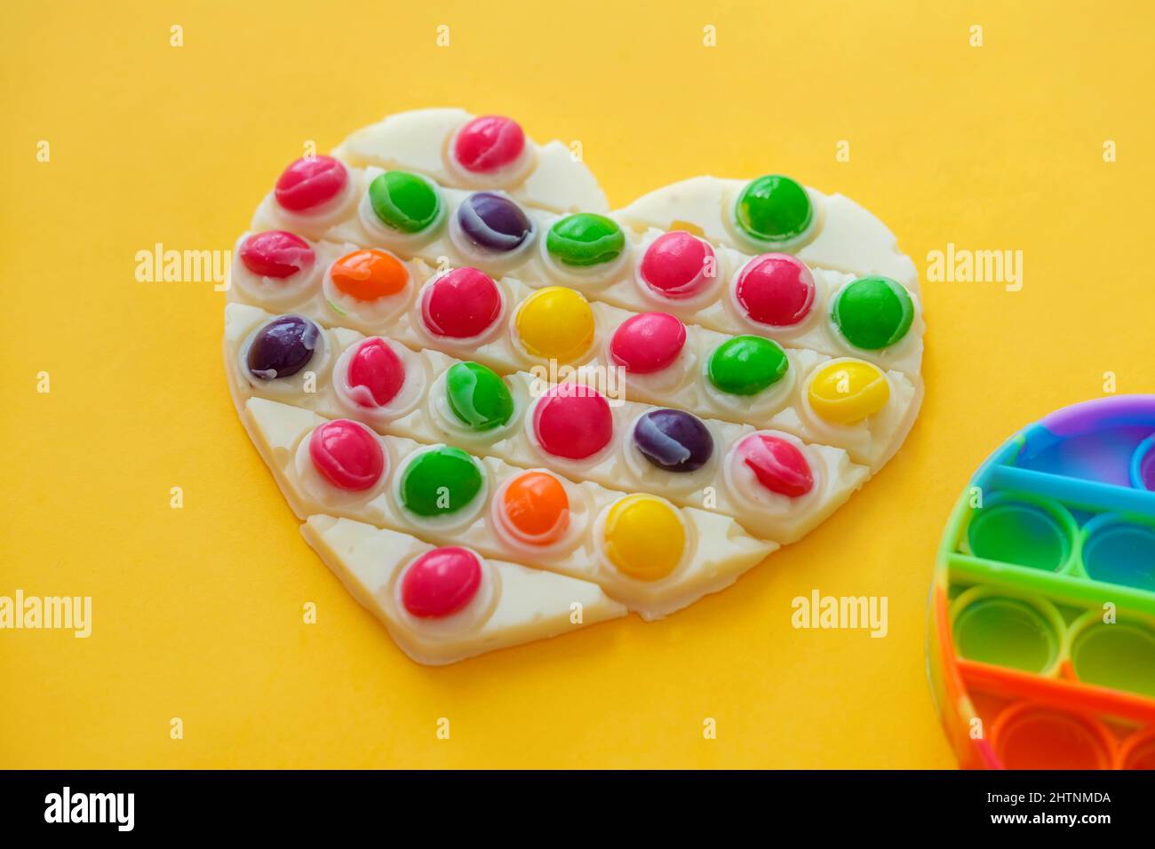 Use the popular pop it toy as a chocolate mold. White chocolate and ...
