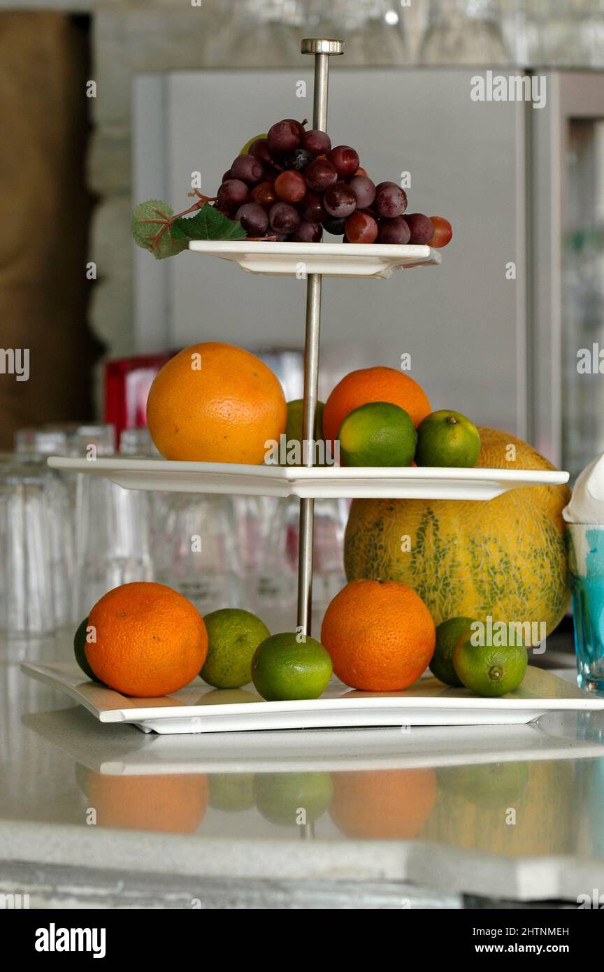 Different fruit arranged on plats Stock Photo - Alamy