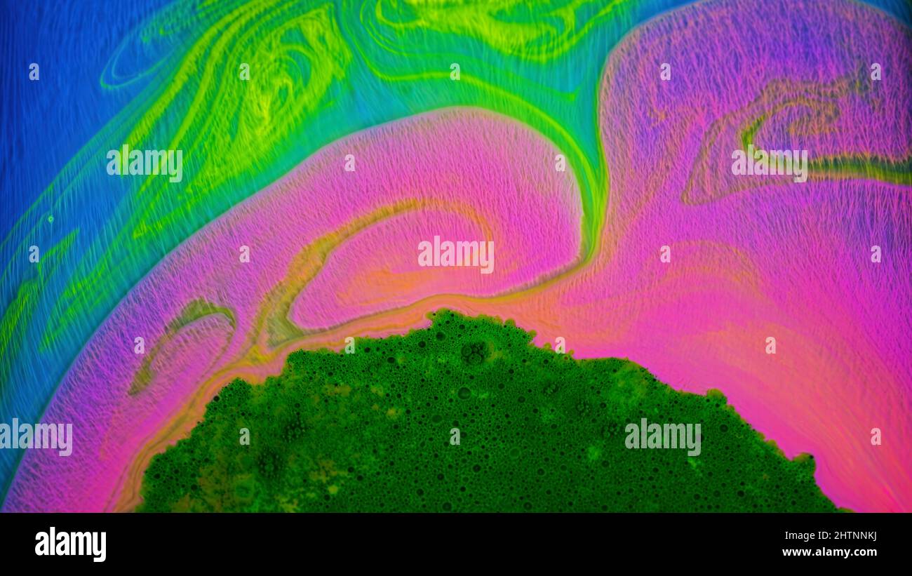 Mixing acidic paints. Stock footage. Bright acidic inks of different ...