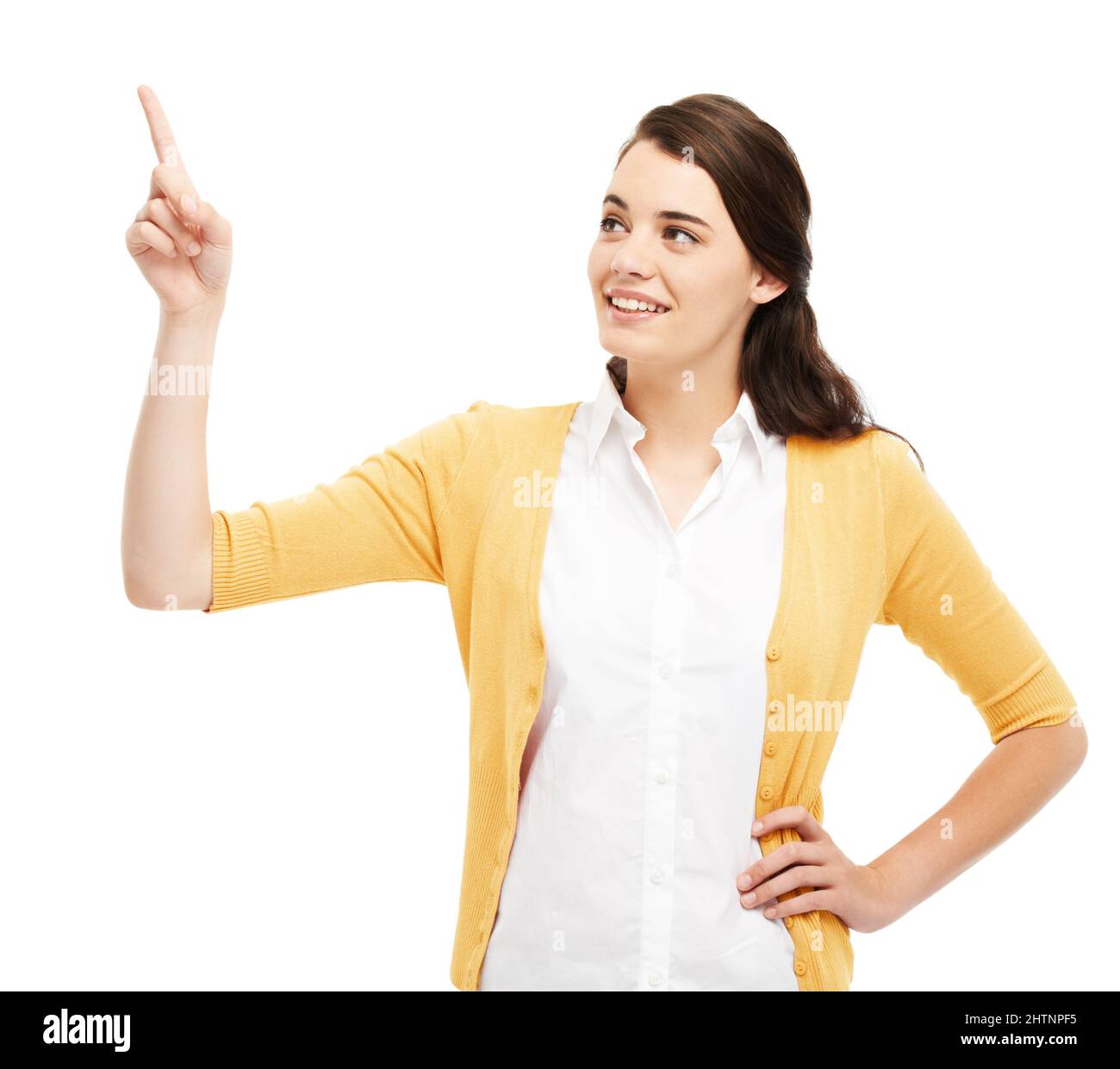 Pointing towards the answer. Attractive young woman pointing upwards ...