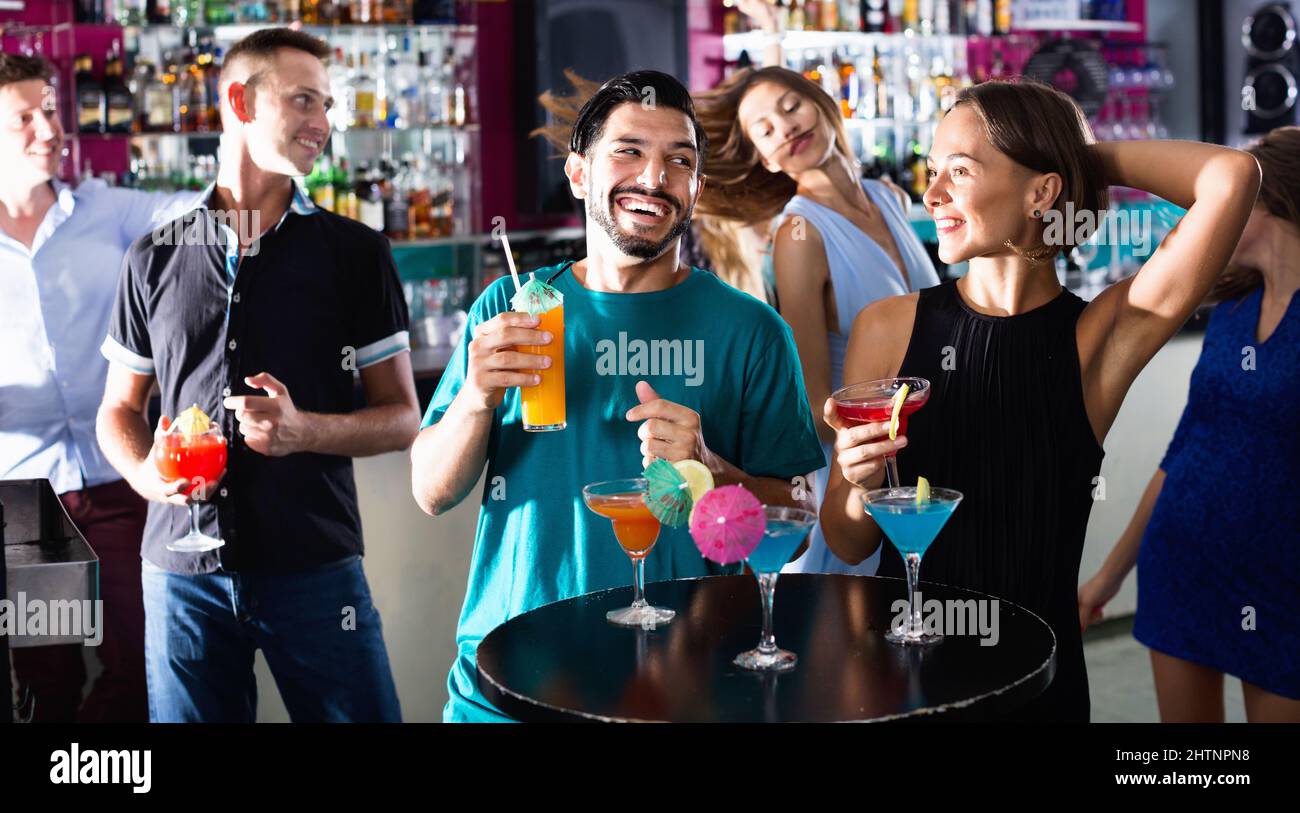 Man with woman are drinking cocktails on corporate party Stock Photo ...