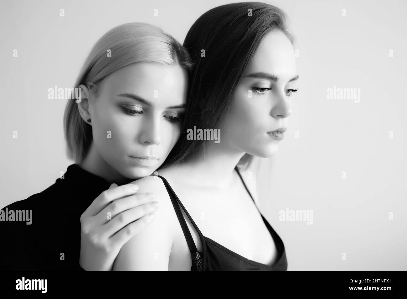 Top view of two young women on a light background Stock Photo - Alamy