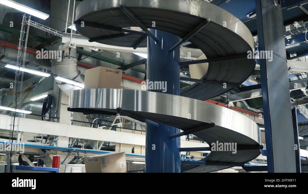 Cardboard boxes on conveyor belt in factory. Clip. Production line on ...