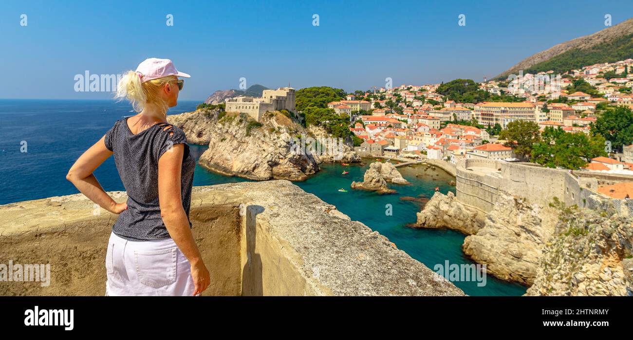 Girl with hat on Dubrovnik city walls of Croatia. Fort Lovrijenac ...