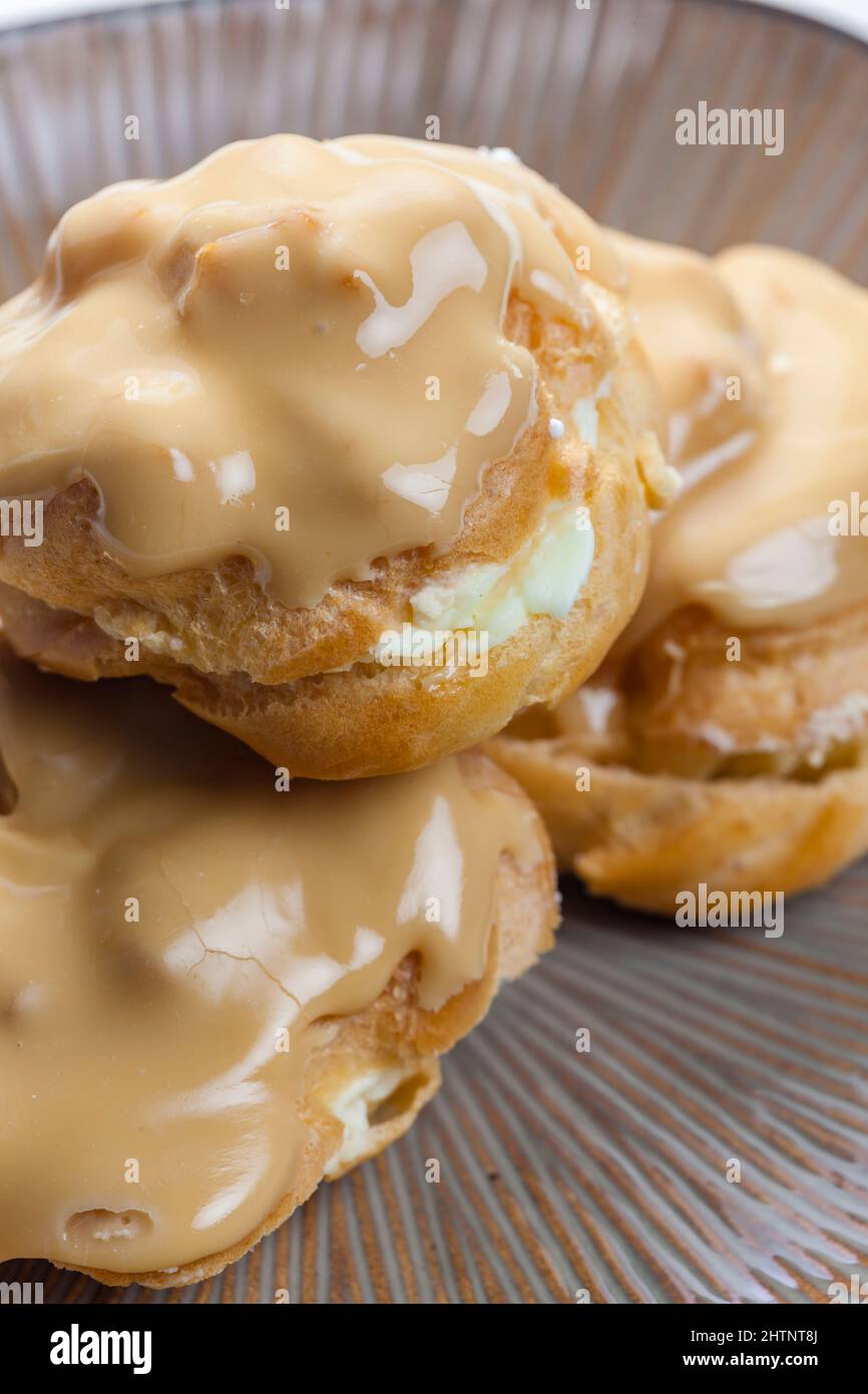 Three cream puffs hi-res stock photography and images - Alamy