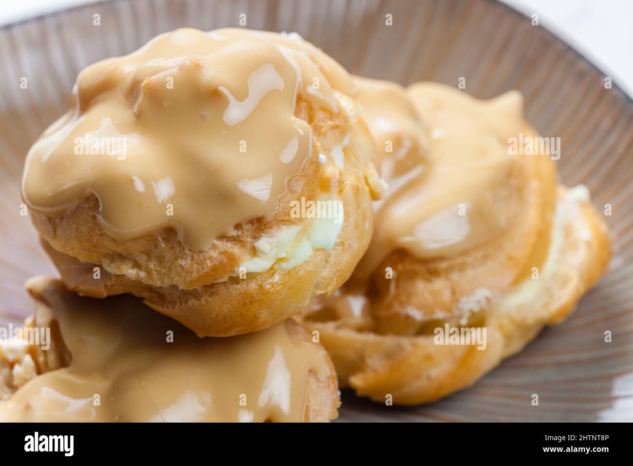 Three cream puffs hi-res stock photography and images - Alamy