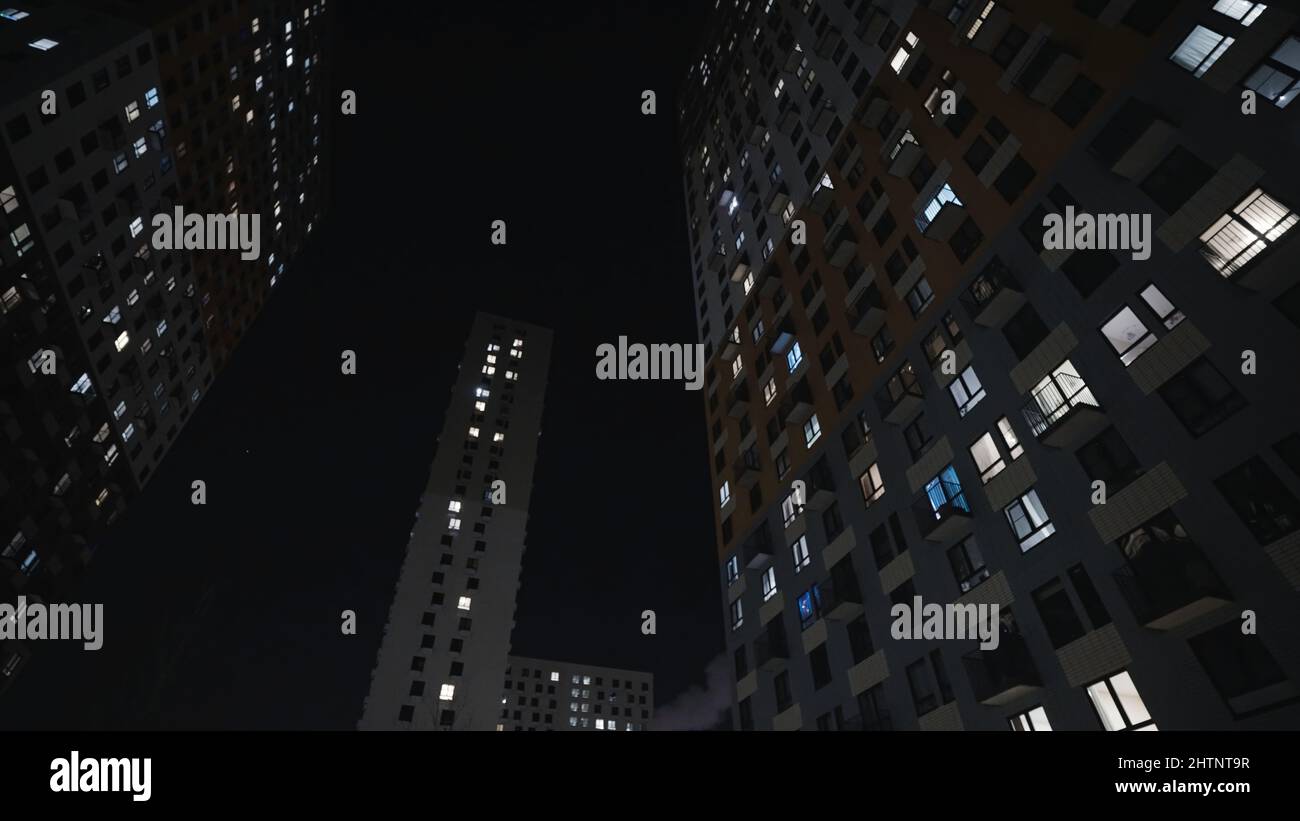 Beautiful residential buildings on background of night sky. Action ...