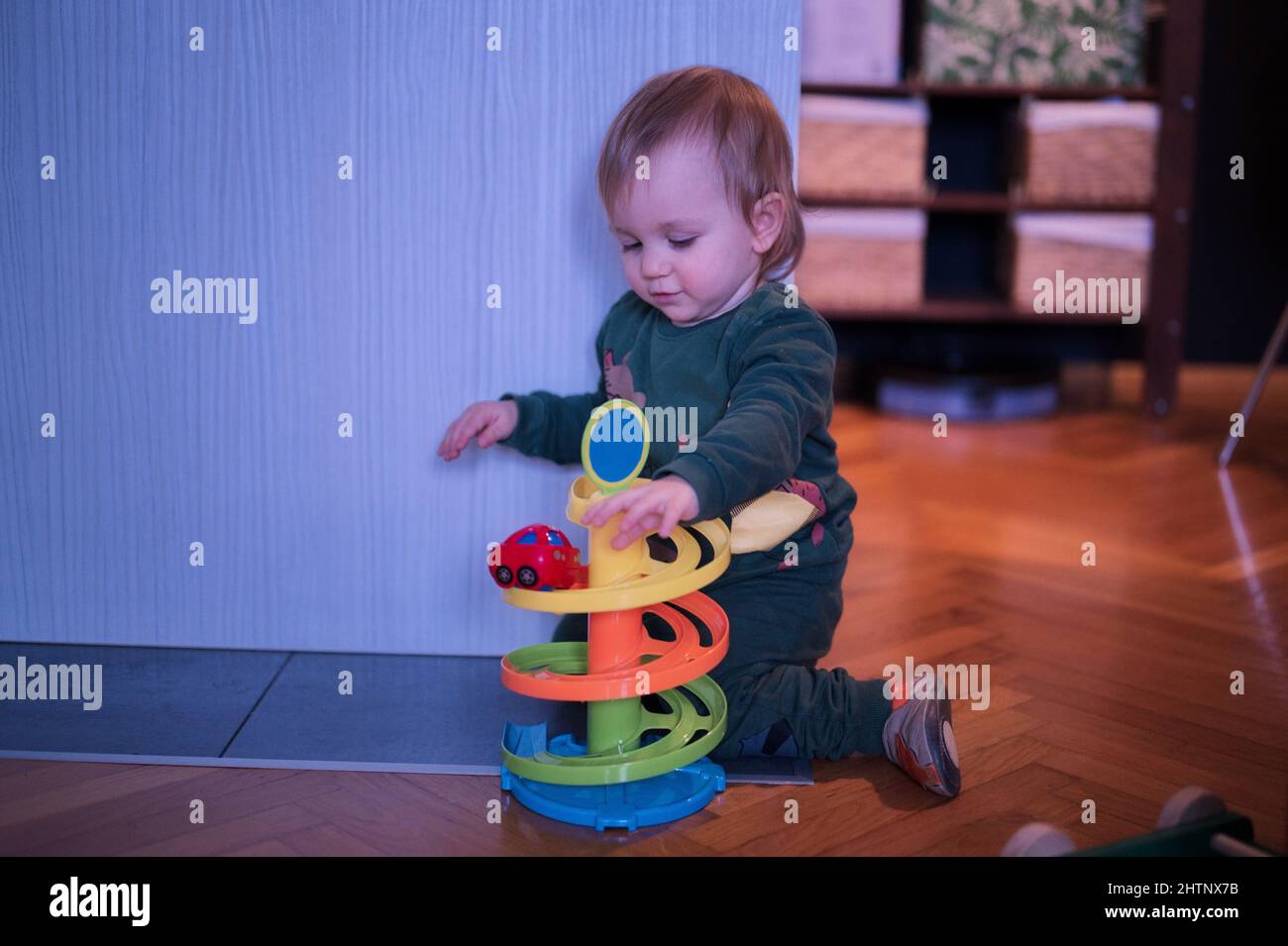 Portrait of cute little boy playing on the floor Stock Photo - Alamy