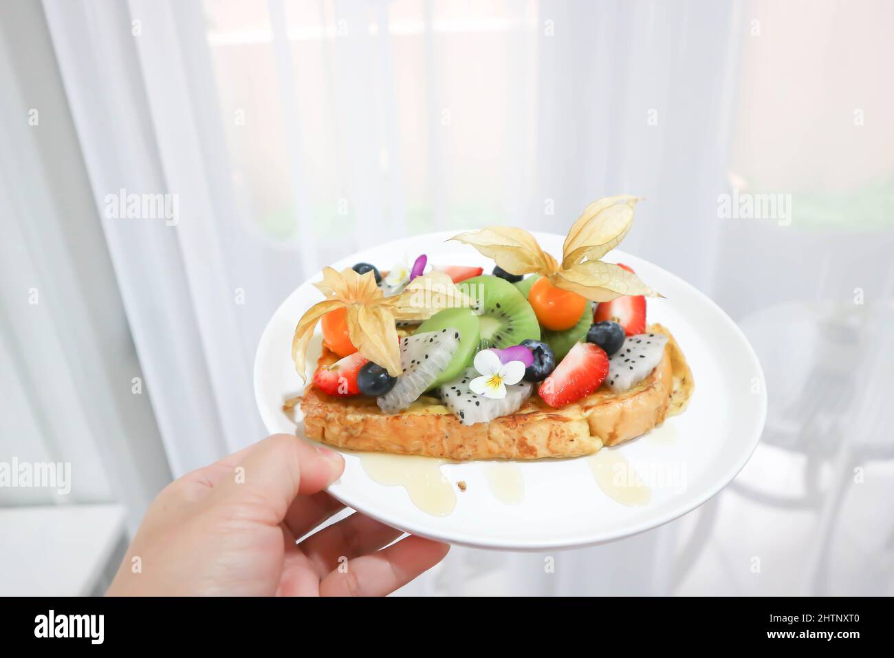 toast or French toast with fruit topping Stock Photo - Alamy