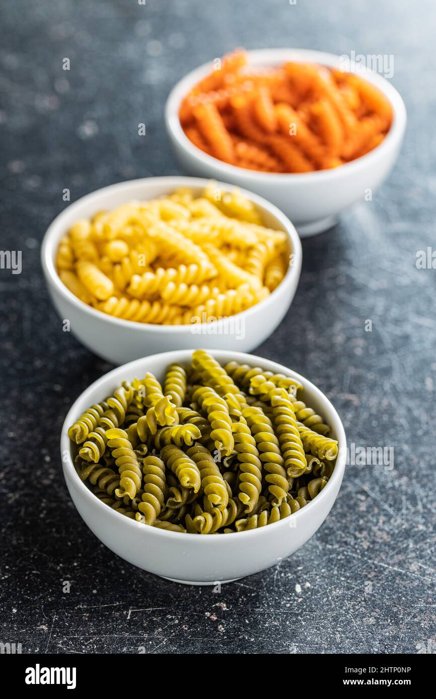 Three colors fusilli pasta. Colorful italian raw pasta in bowl Stock ...