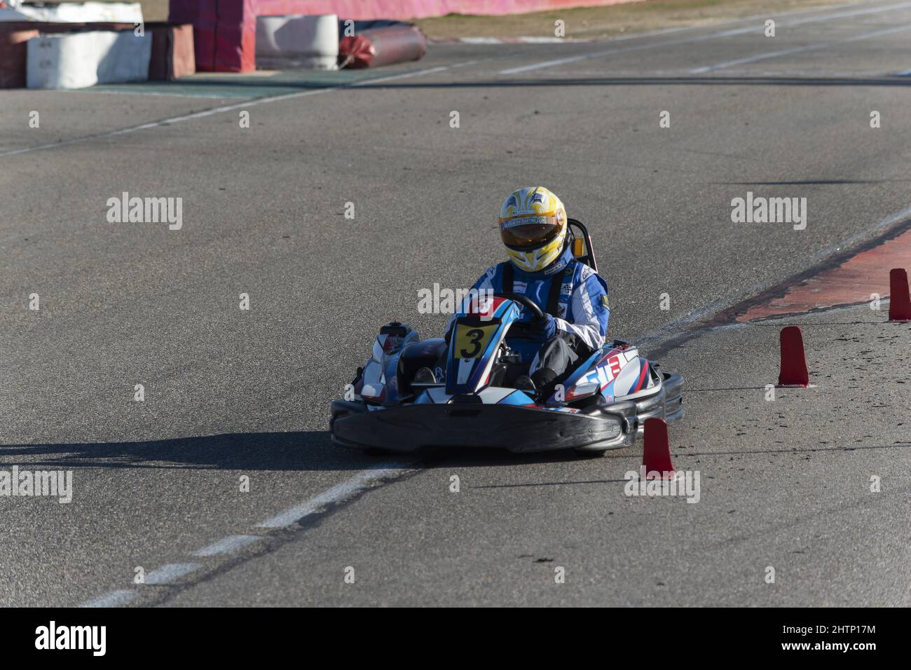 A closeup of a Man racing Go-cart on karting circuit Stock Photo - Alamy
