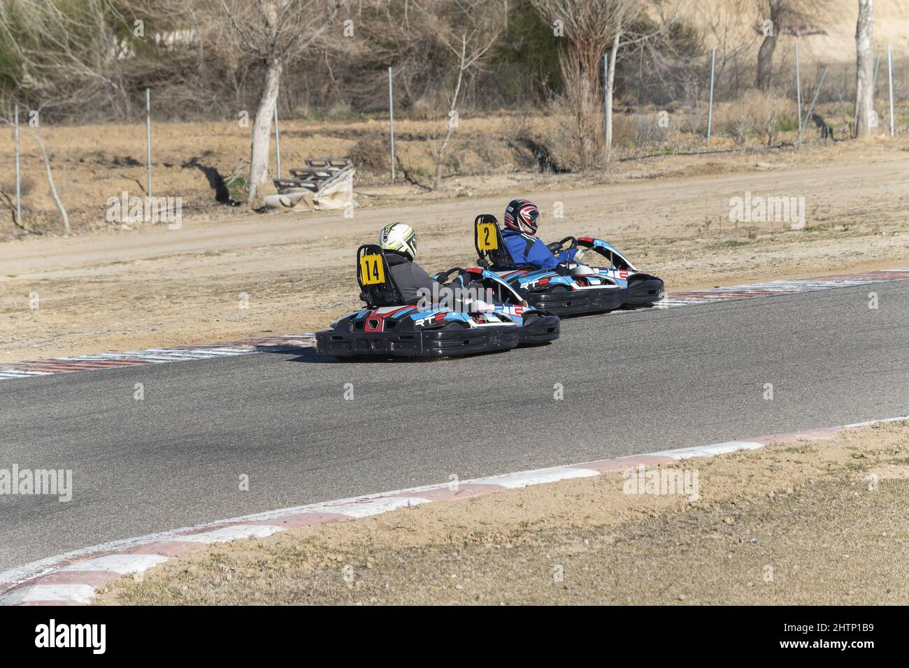 Closeup of boys racing Go-cart on karting circuit in Recas, Spain Stock ...