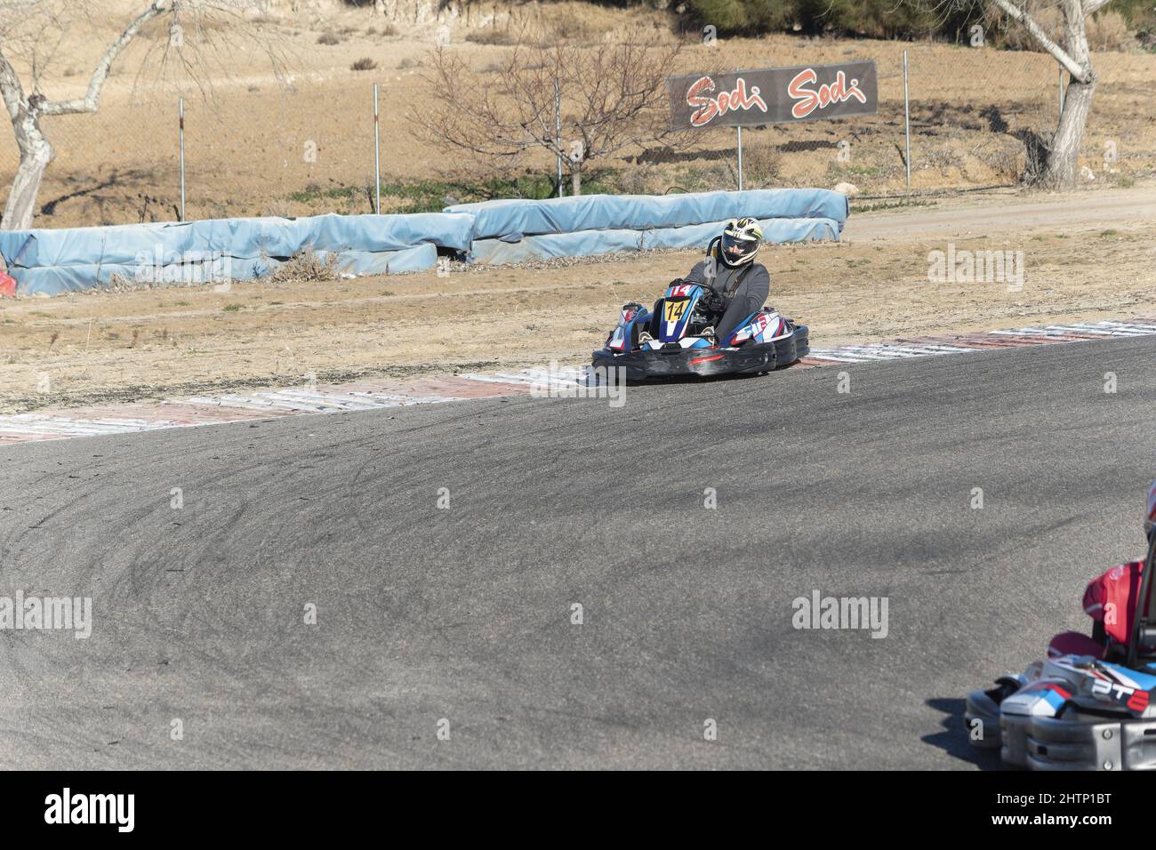 Closeup of a Man racing Go-cart on karting circuit Stock Photo - Alamy