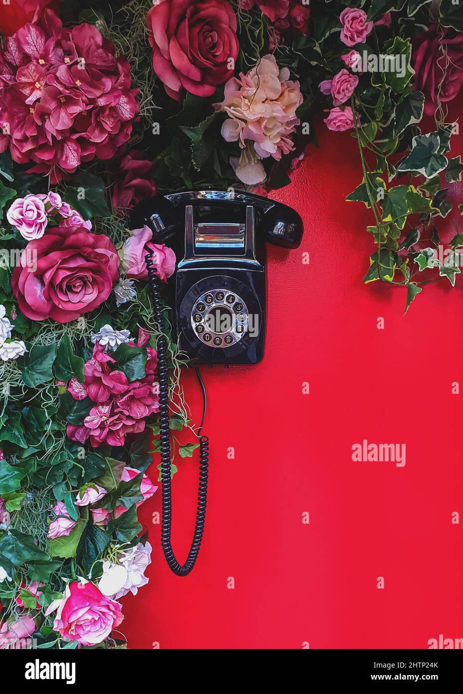 Old antique black telephone and beautiful flower arrangement Stock ...