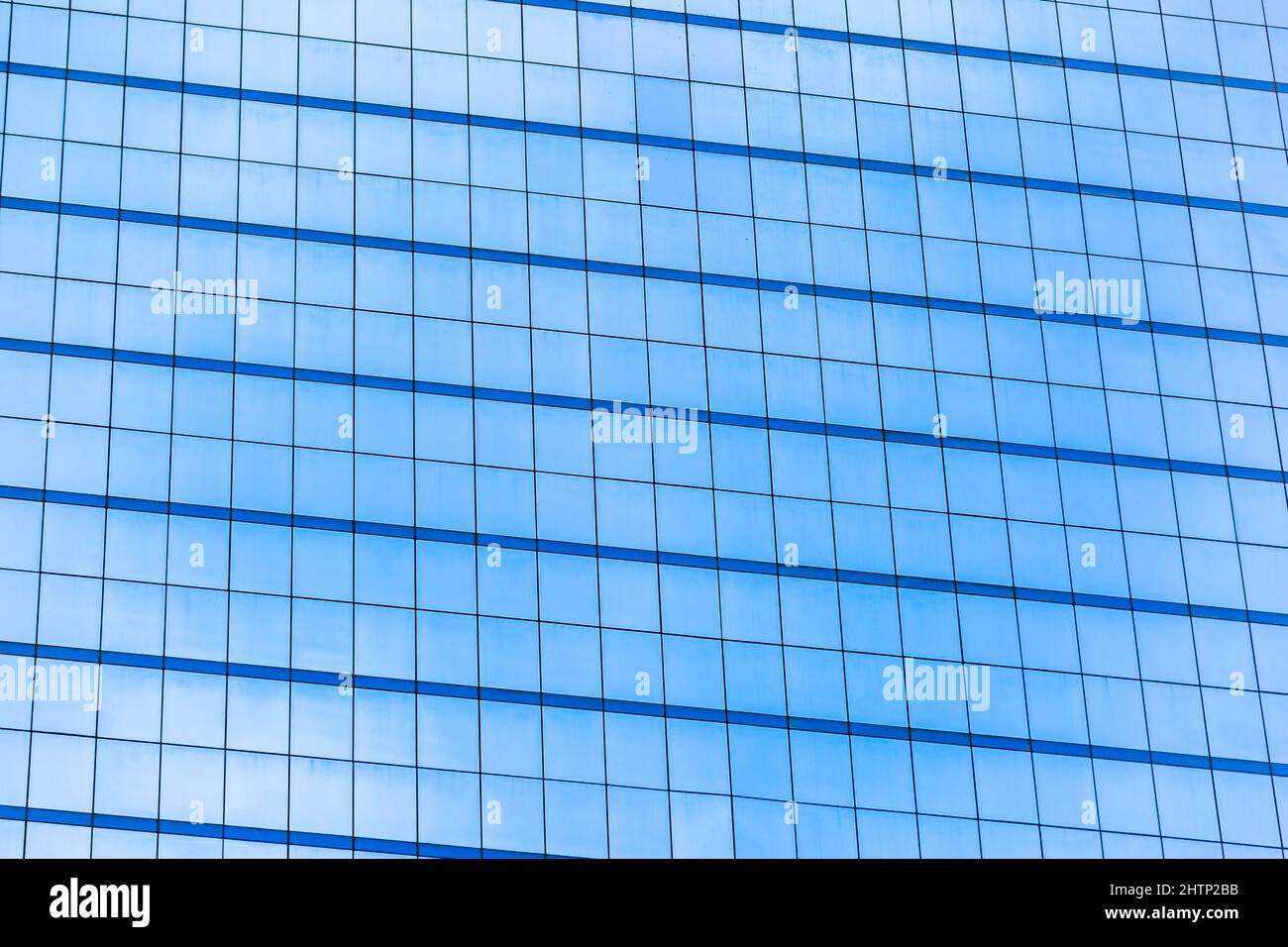 Blue glass windows of office building for background Stock Photo - Alamy