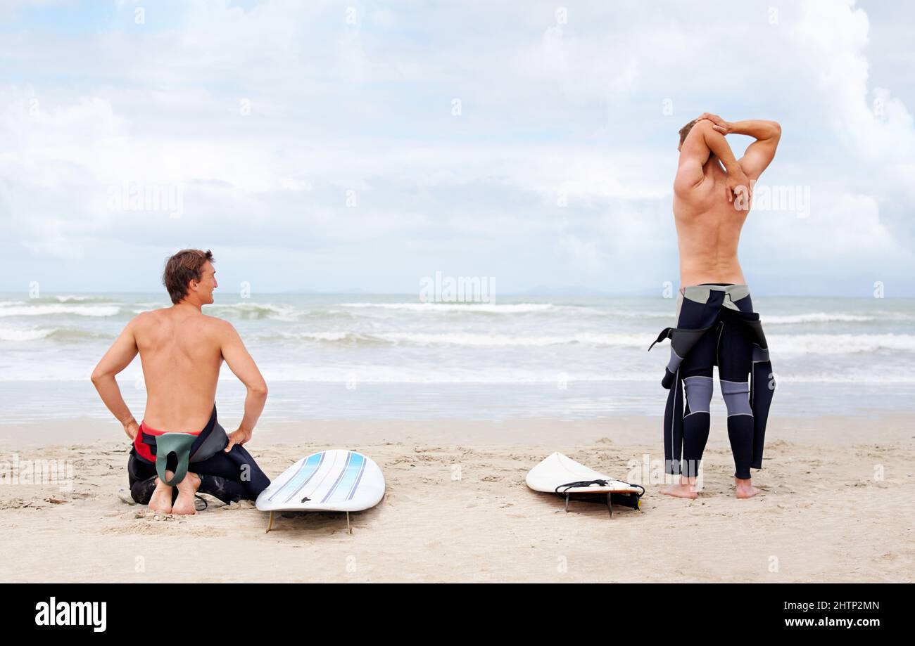 Surfing is a lifestyle. Young surfers enjoying a day out on the beach ...