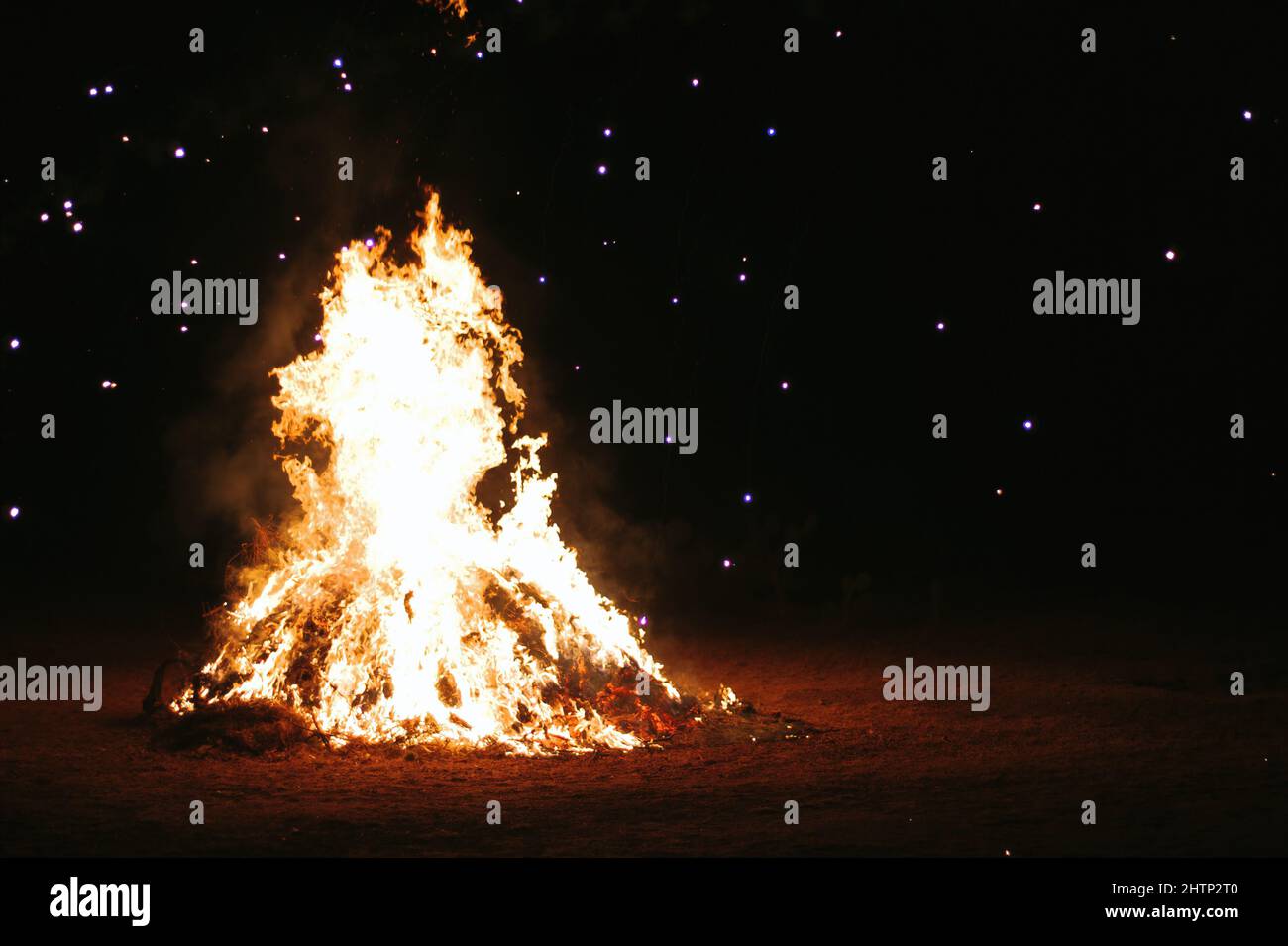 Fire burning at night Stock Photo - Alamy