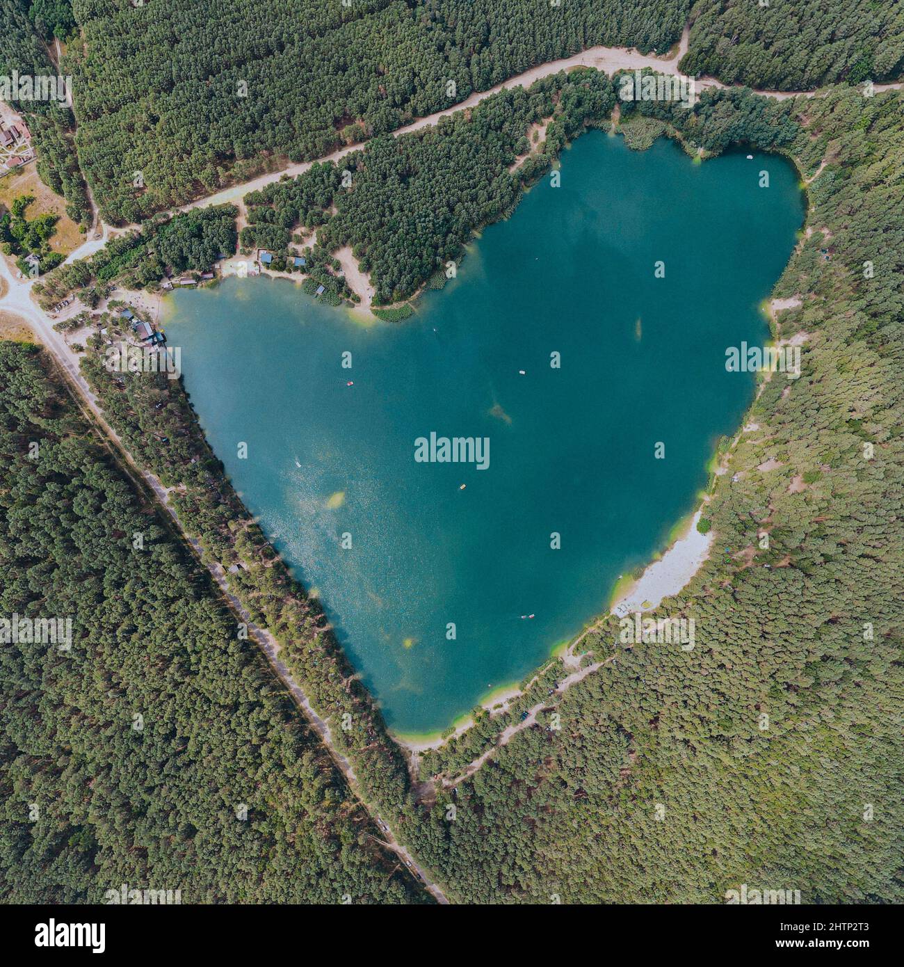 Aerial view of a heart-shaped lake in the greenery Stock Photo - Alamy