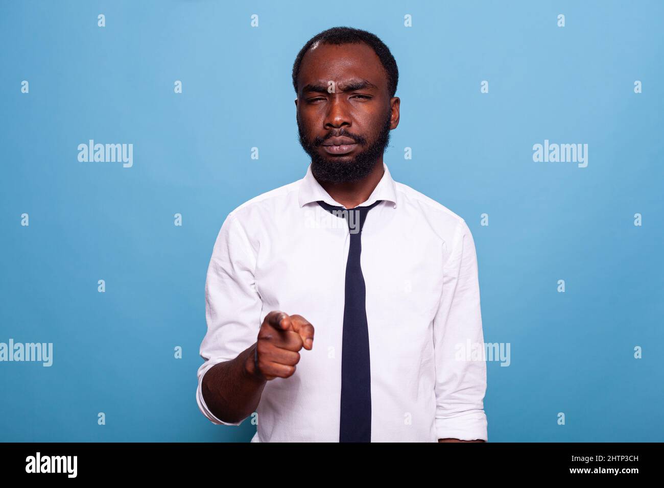 Standing businessman looking perplexed pointing at you recognizing ...