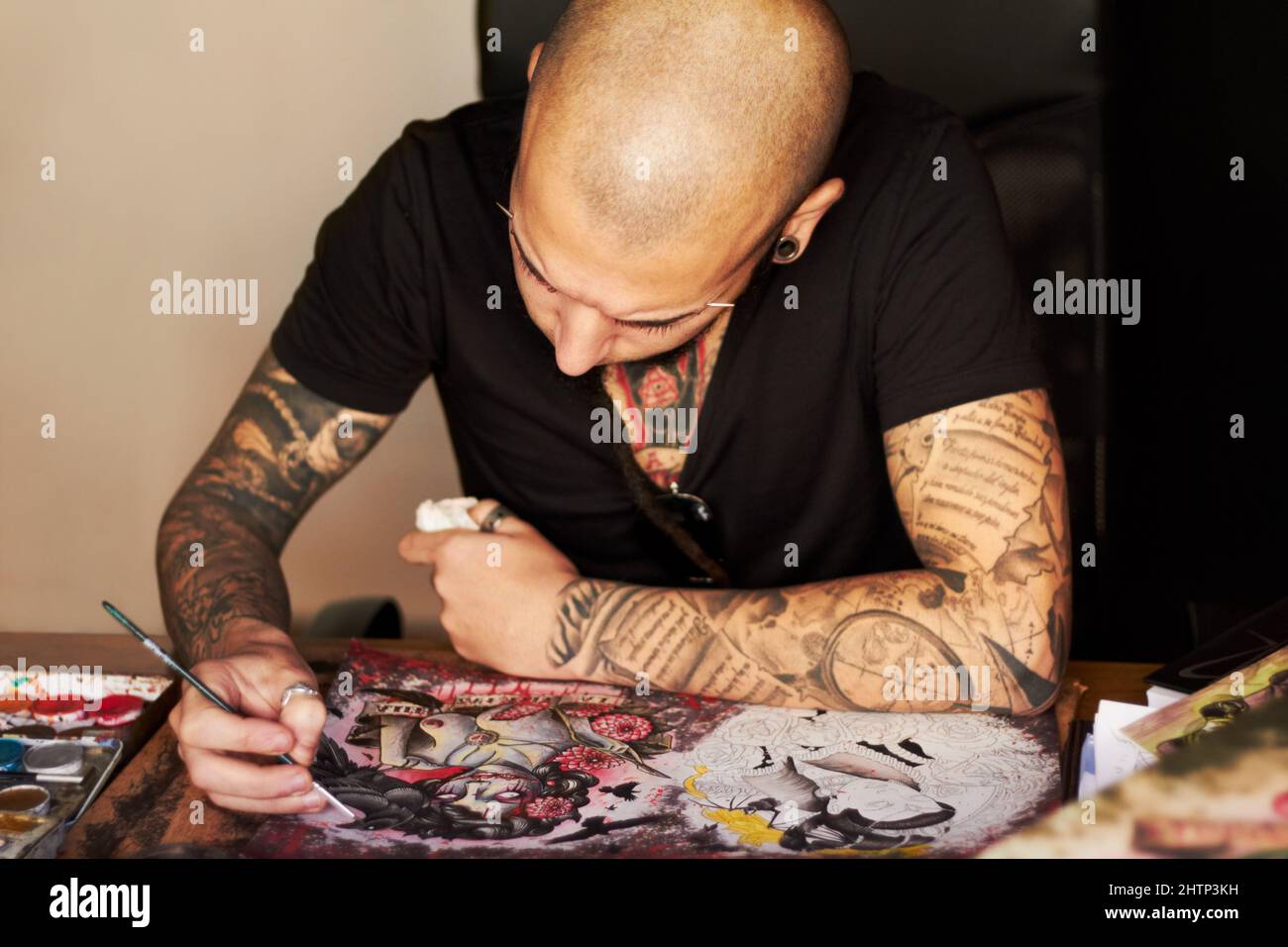 My latest tattoo design. A young man drawing a tattoo design Stock ...