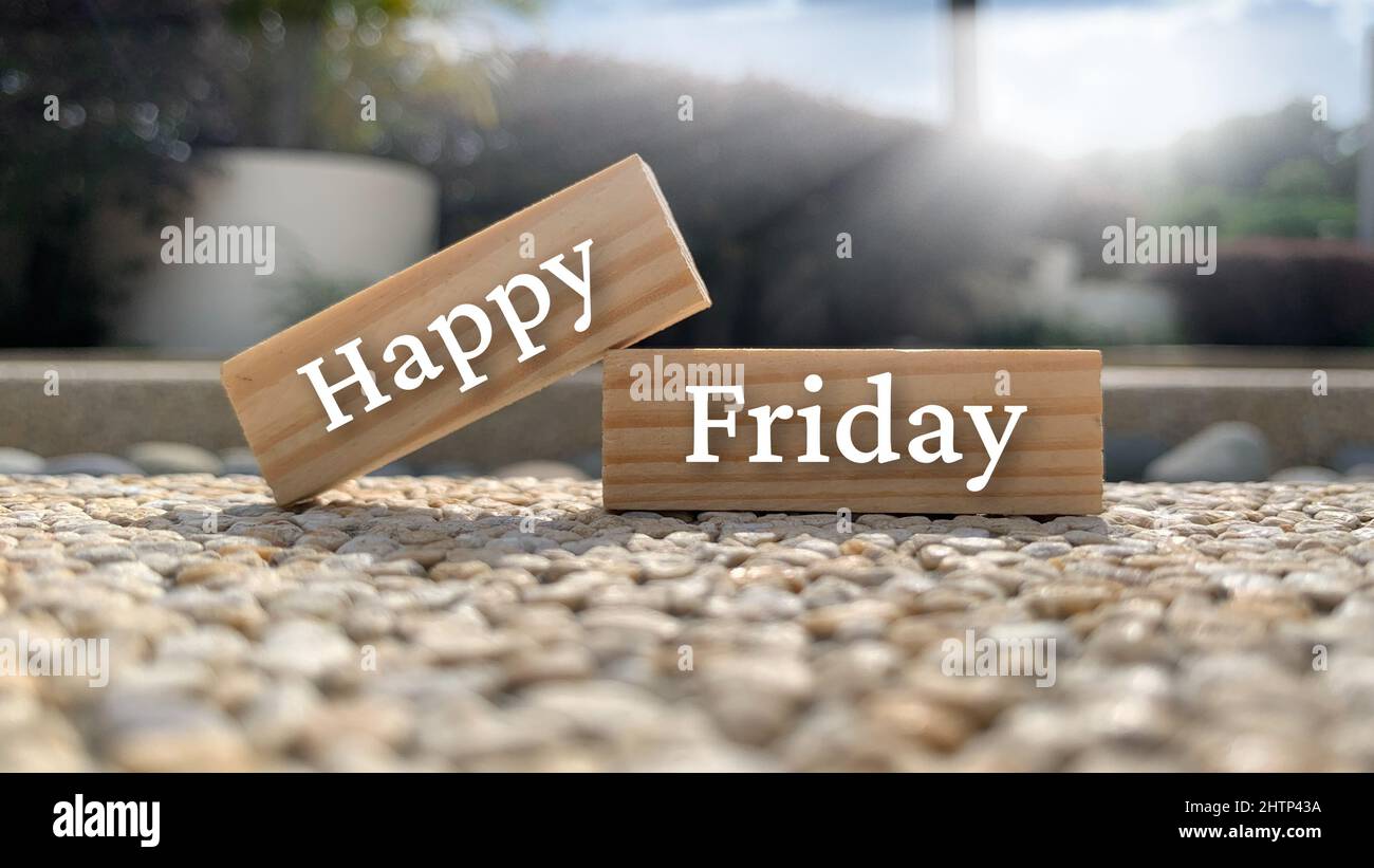 Happy Friday text on wooden blocks with bright sun background Stock ...