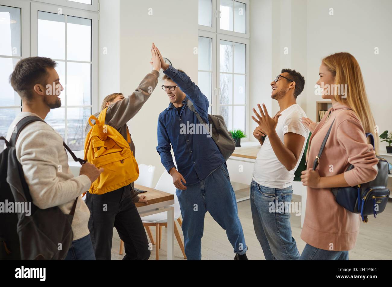 Smiling diverse students give high five celebrate achievement Stock ...