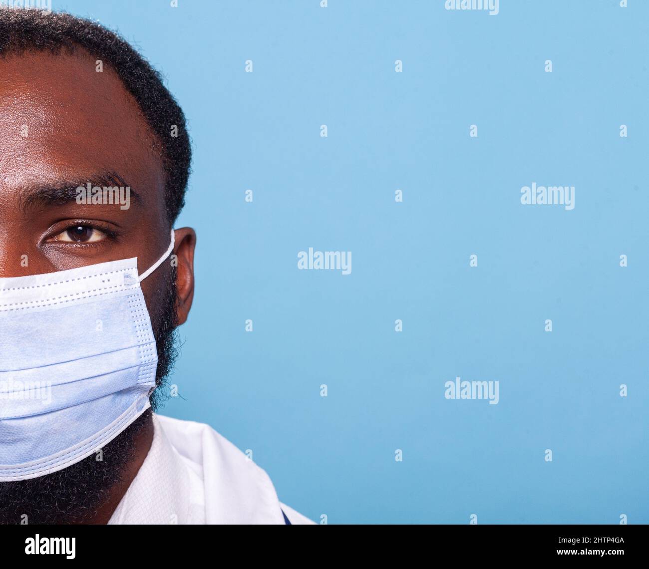 Half face closeup portrait of medical doctor wearing protective ...