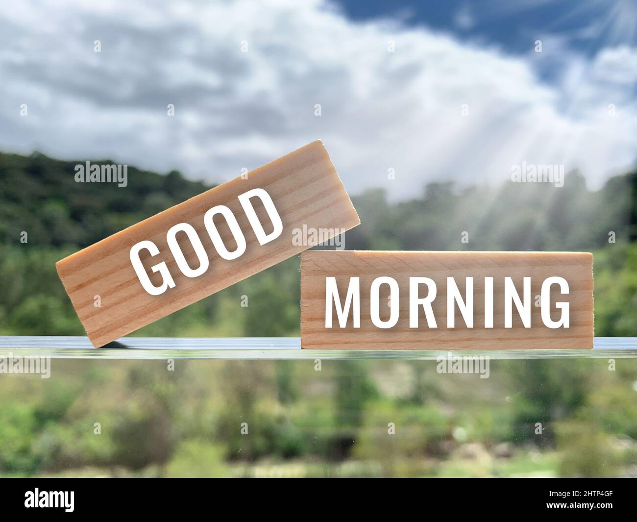Good Morning text on wooden blocks with bright sun background Stock ...