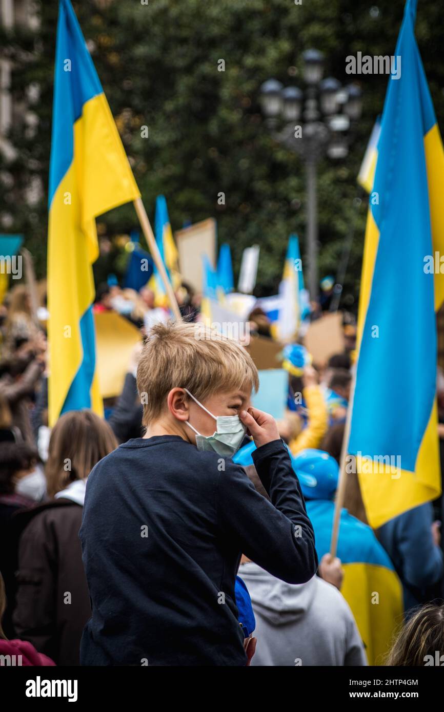 Ukrainian Kid Crying on His Father's Shoulders With National Flags ...