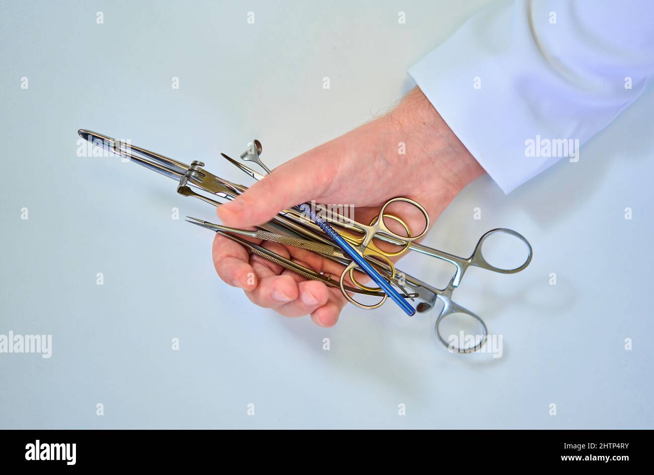 doctor holds surgical instruments in his hands Stock Photo - Alamy