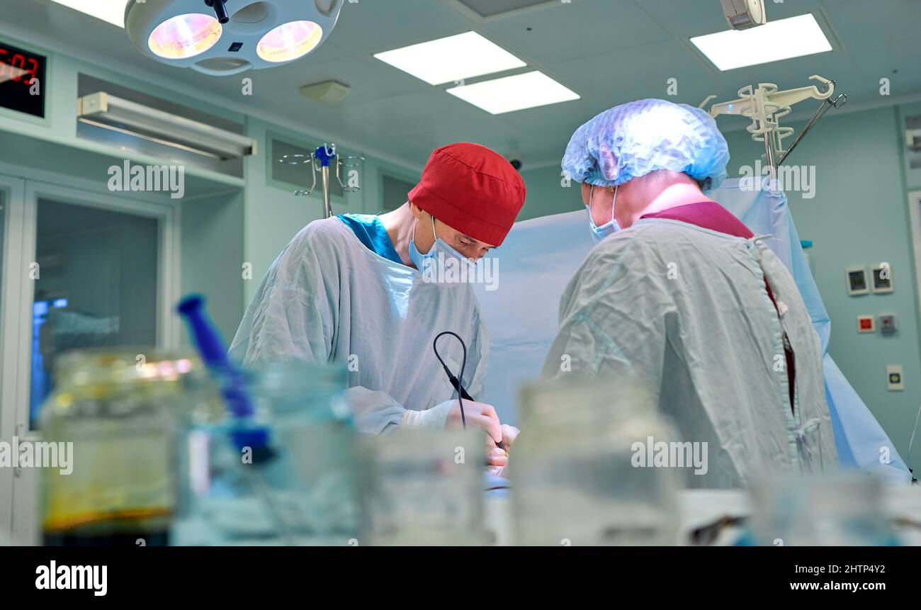 surgeon in the operating room performs an operation on a patient Stock ...